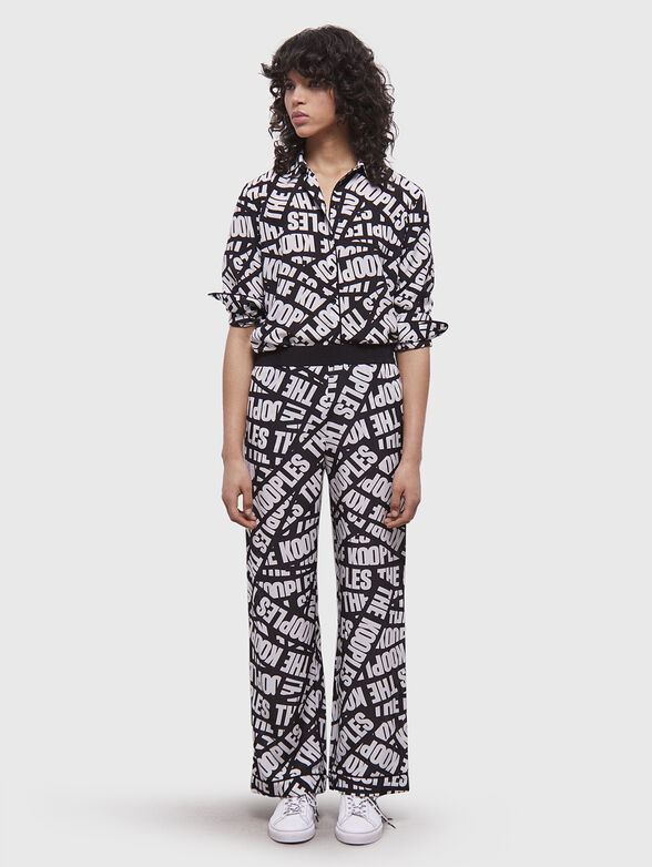 Pants with monogram logo print brand THE KOOPLES — Globalbrandsstore.com/en